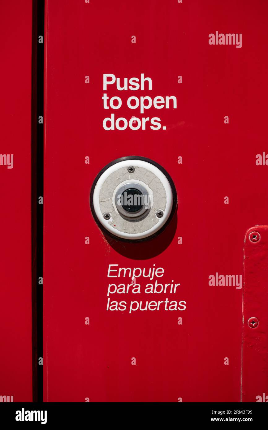 Button for opening doors on red transit train Stock Photo - Alamy