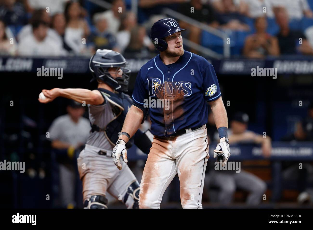 Tampa Bay Rays' Luke Raley walks to dugout after striking out against ...