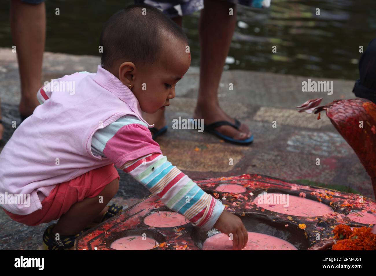 Child with snake hi-res stock photography and images - Alamy