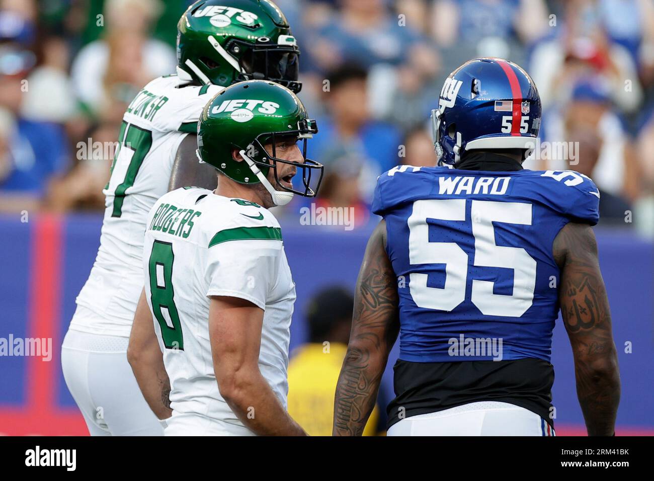 New York Jets quarterback Aaron Rodgers (8) and New York Giants ...