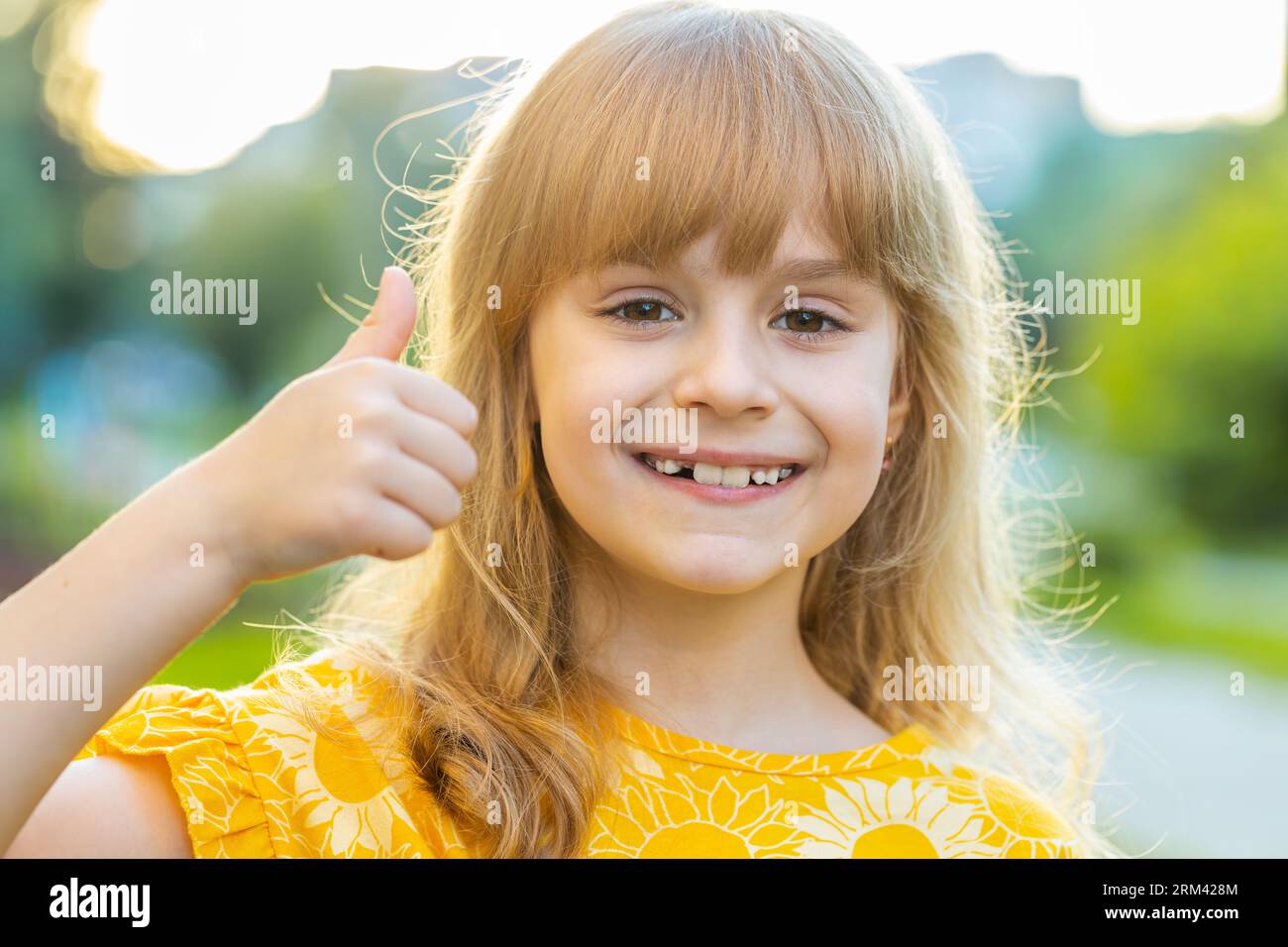Like. Happy preteen child kid looking approvingly at camera showing thumbs up, like ok yes sign ...