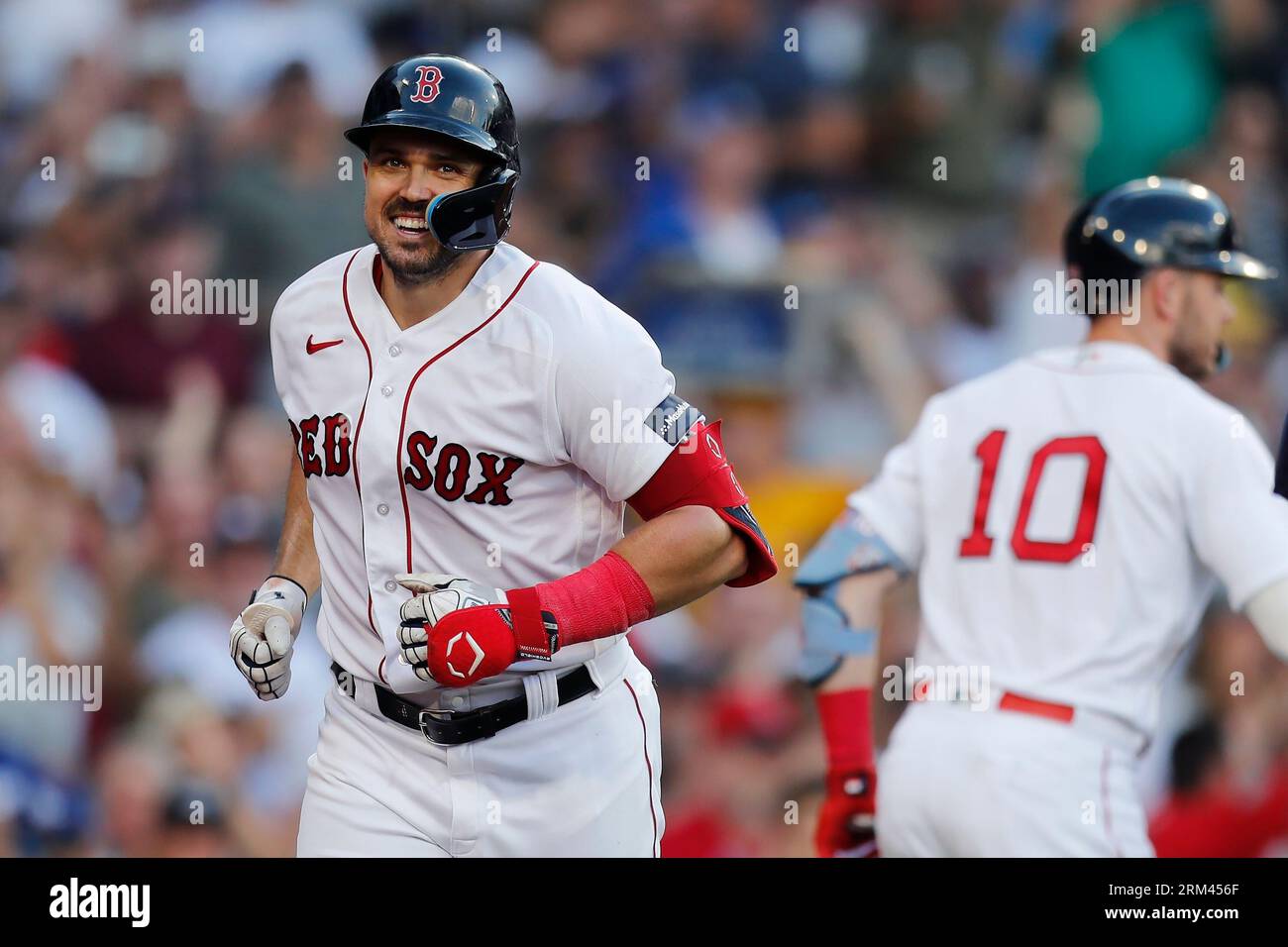 Boston Red Sox's Adam Duvall heads to the dug out after hitting a three ...