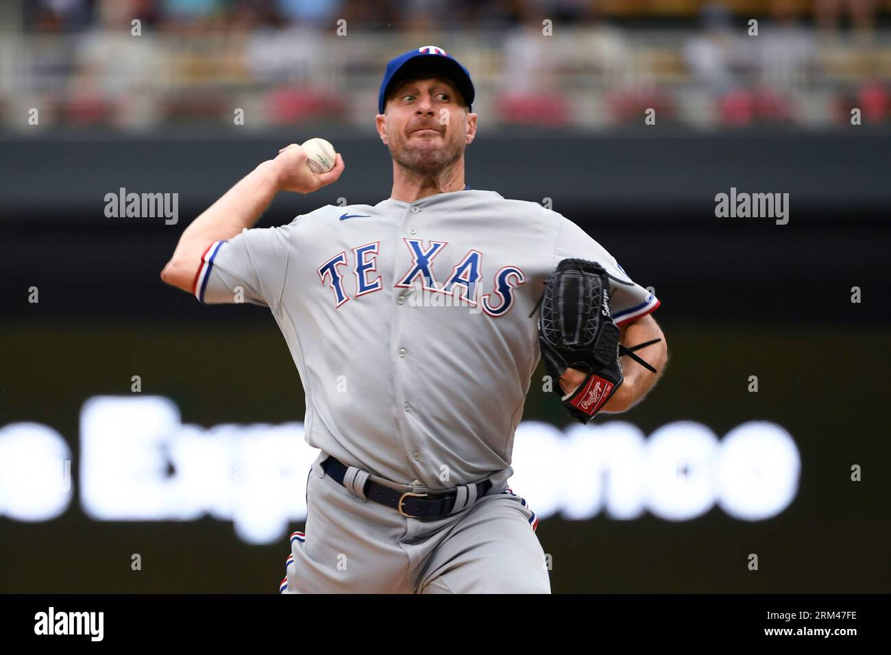 Texas Rangers pitcher Max Scherzer throws to a Minnesota Twins batter ...