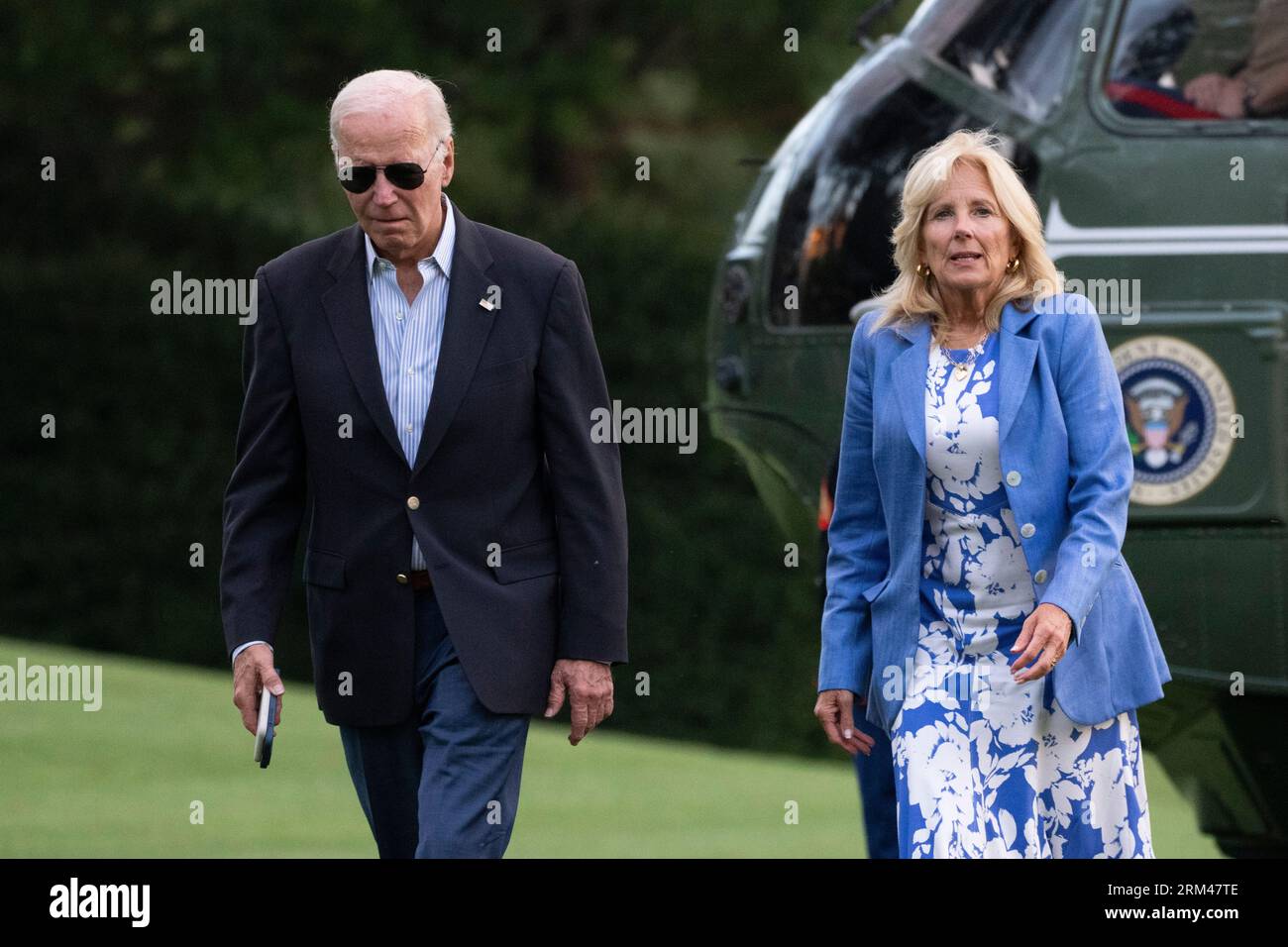 President Joe Biden with first lady Jill Biden walk on the South Lawn ...