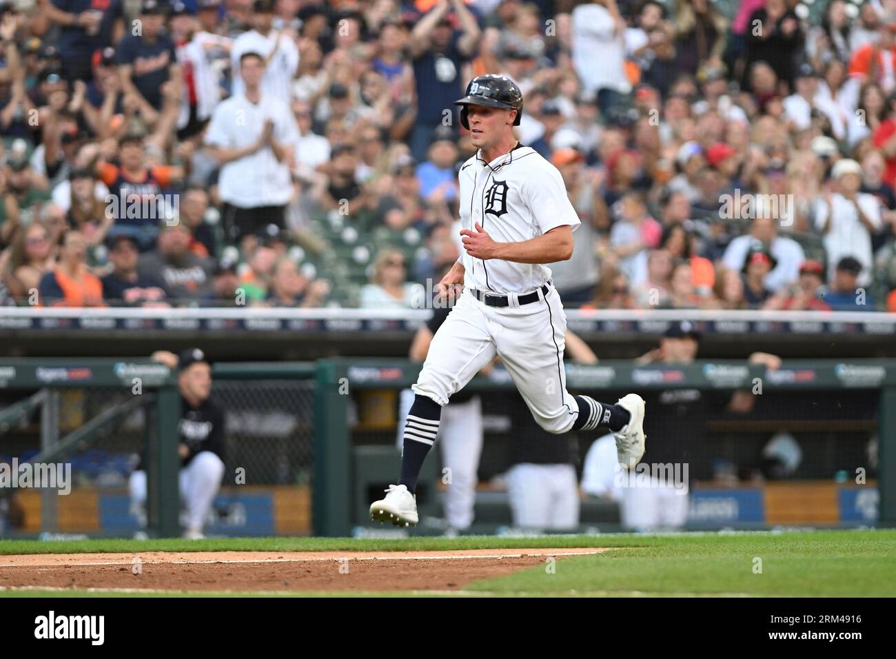 Detroit Tigers designated hitter Kerry Carpenter (30) scores a run on ...