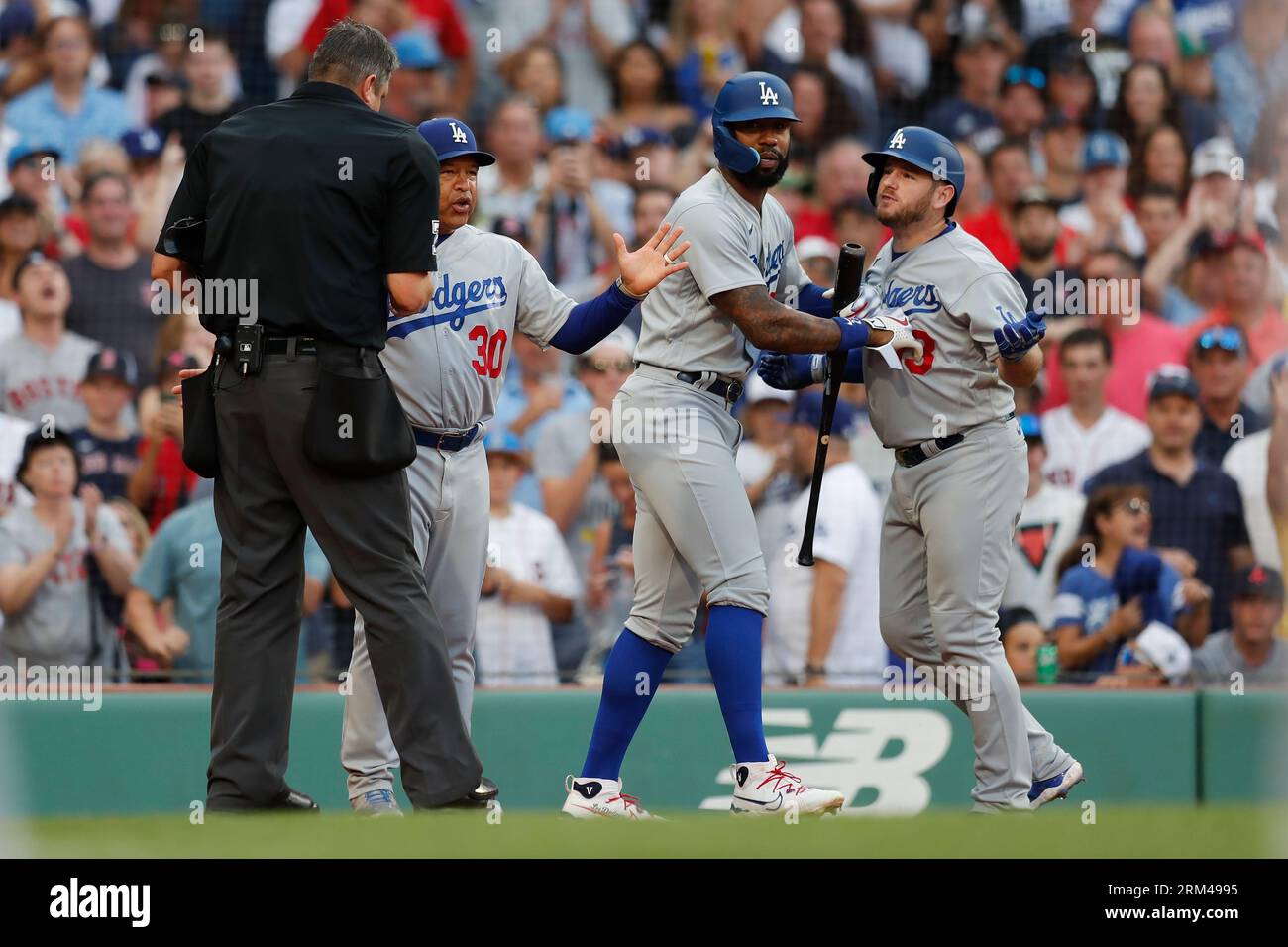 Los Angeles Dodgers' Jason Heyward, center, restrains Max Muncy as ...
