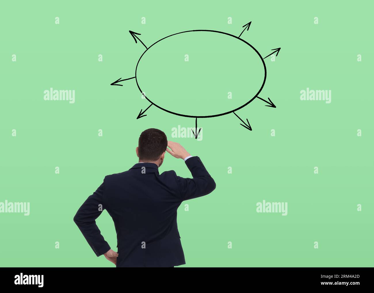 Logic. Man standing in front of diagram on pale green background, back ...