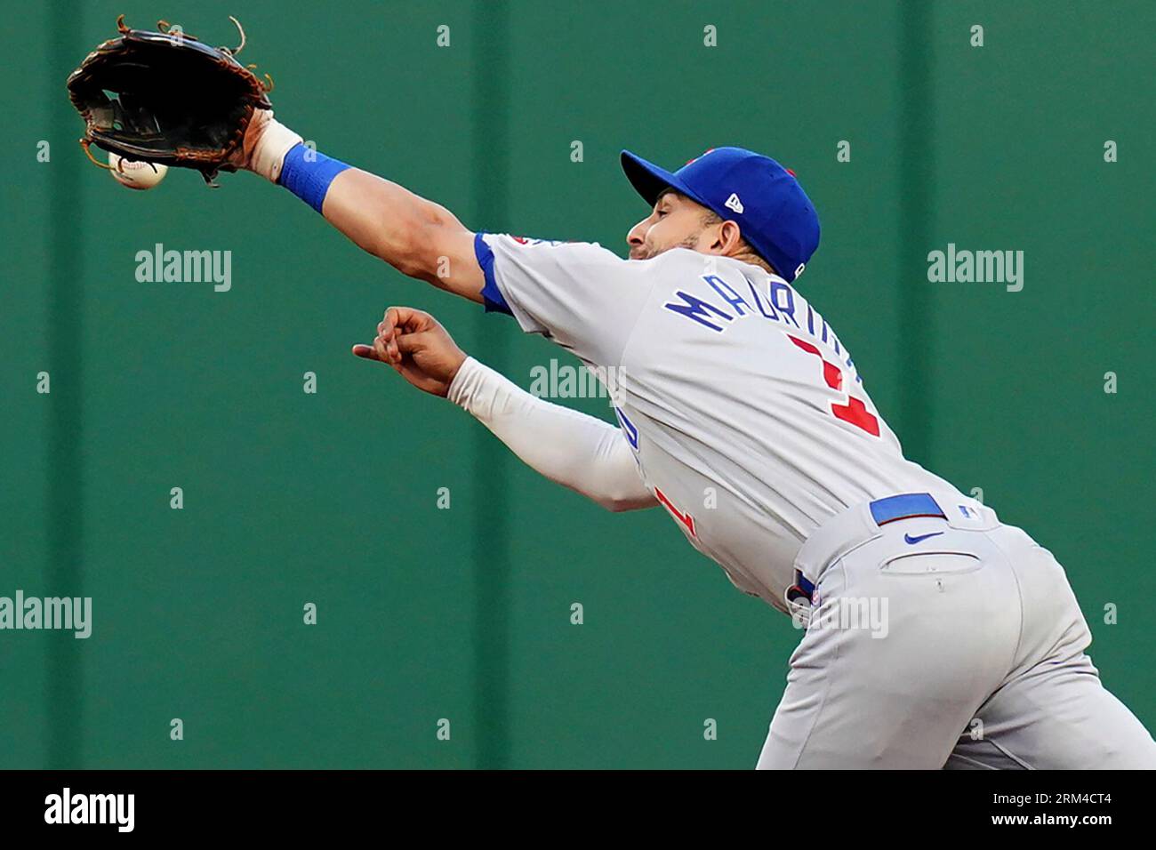 Chicago Cubs second baseman Nick Madrigal reaches for the ball on a ...