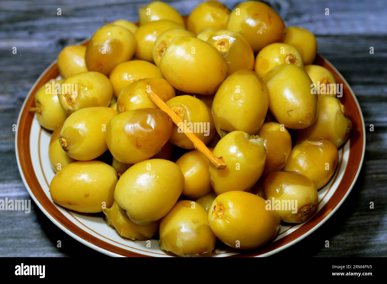 Yellow Barhi dates, botanically classified as Phoenix dactylifera ...