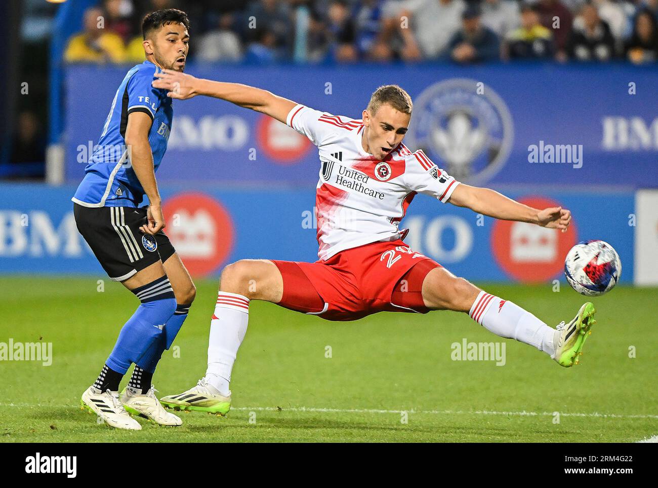 CF Montreal's Mathieu Choiniere, left, defends against New England ...