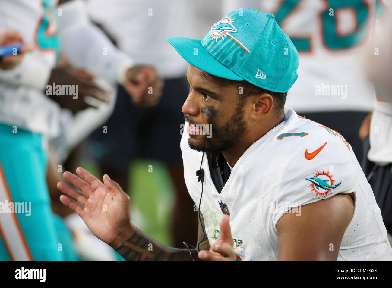 Miami Dolphins quarterback Tua Tagovailoa (1) explains a play on the ...