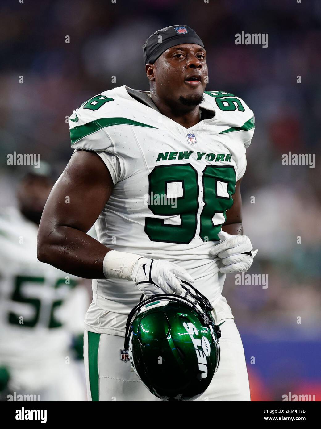 New York Jets defensive end Deslin Alexandre (98) runs off the field ...