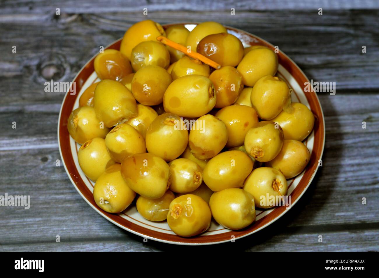 Yellow Barhi dates, botanically classified as Phoenix dactylifera ...