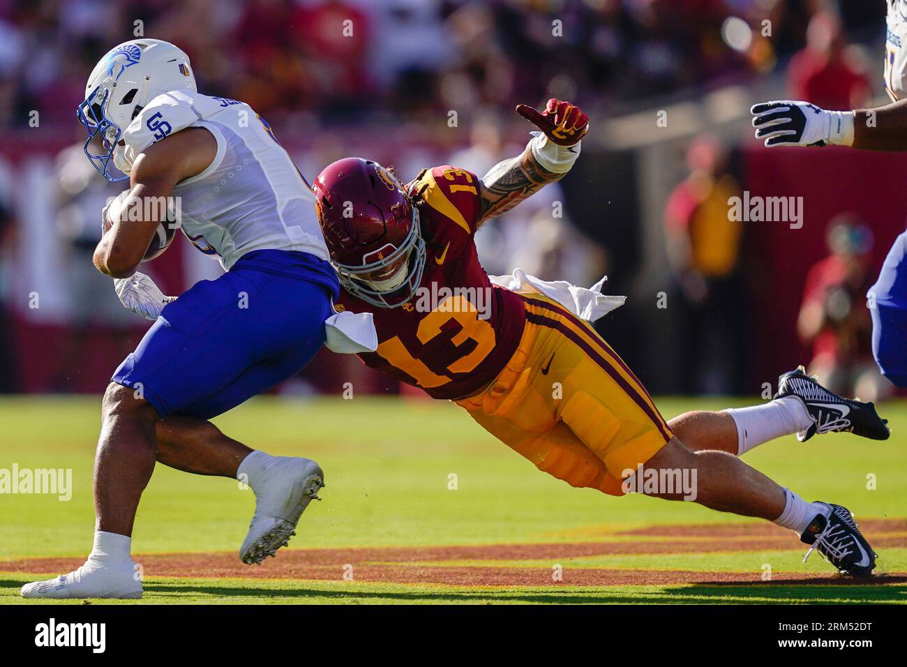 Southern California linebacker Mason Cobb (13) tackles San Jose State ...