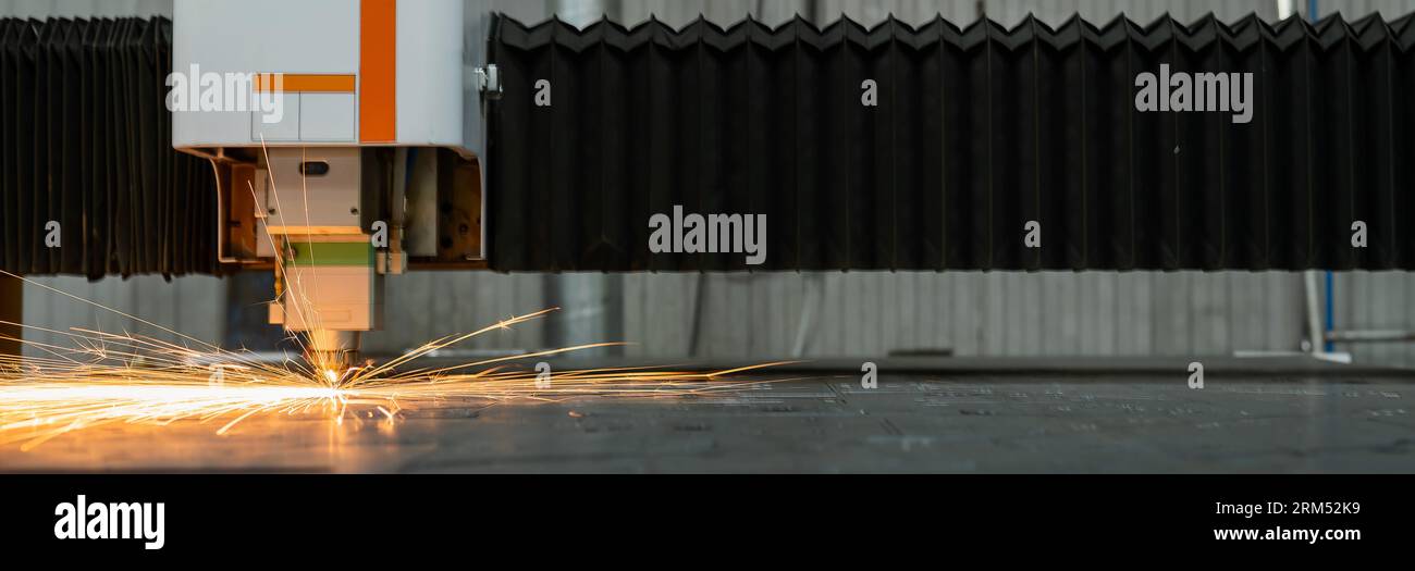 CNC machine. Laser cutting of metal. Sparks Stock Photo - Alamy
