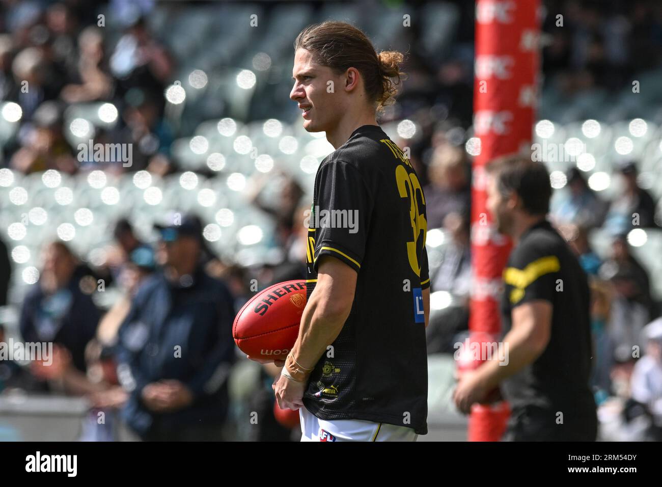 Adelaide, Australia. 27th Aug, 2023. James Trezise of Richmond warming ...