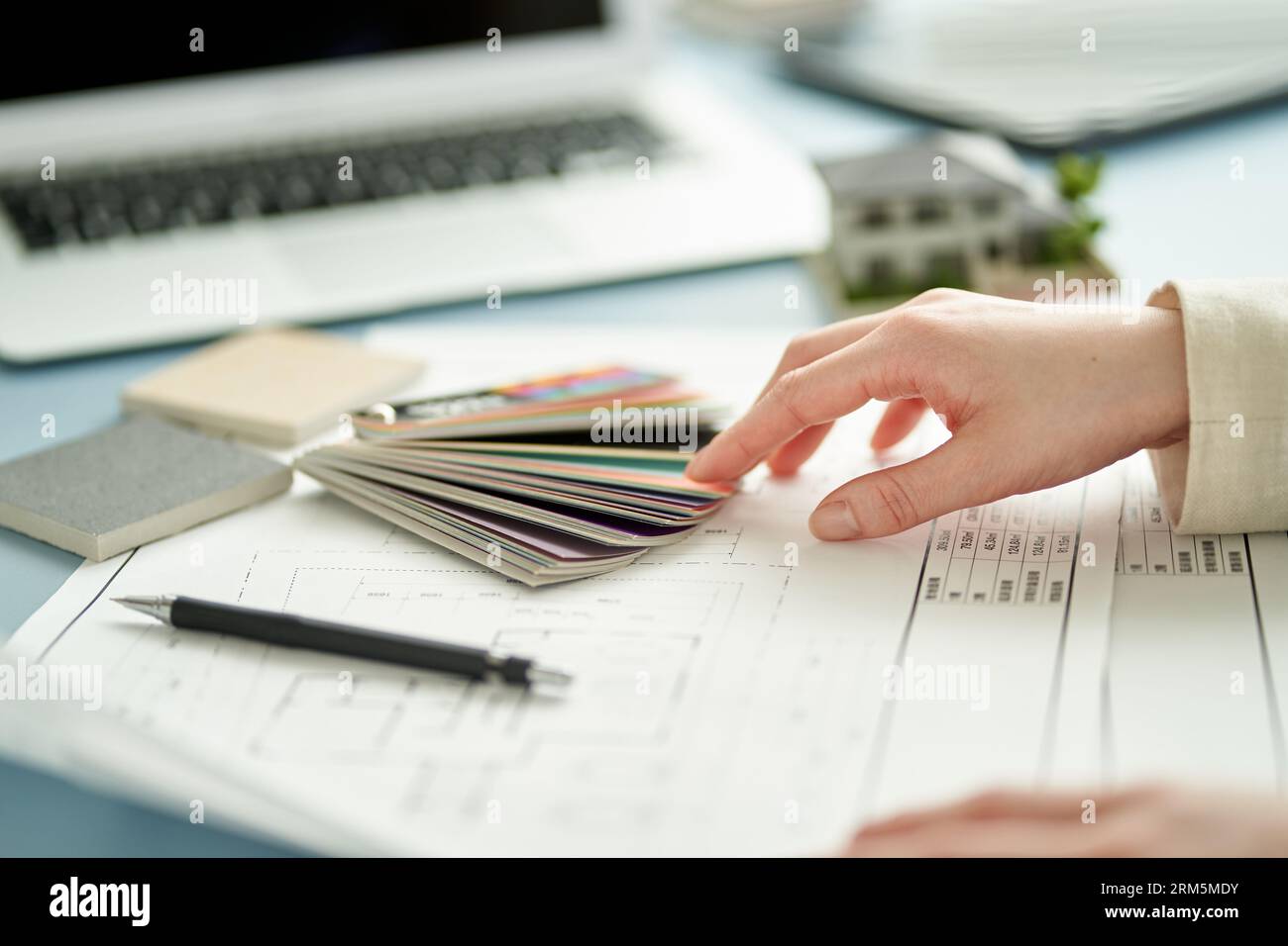 Asian female architect designing a house Stock Photo - Alamy