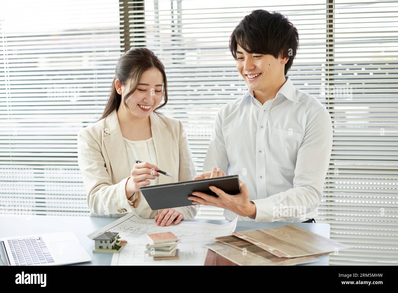 Asian interior designer thinking hi-res stock photography and images ...