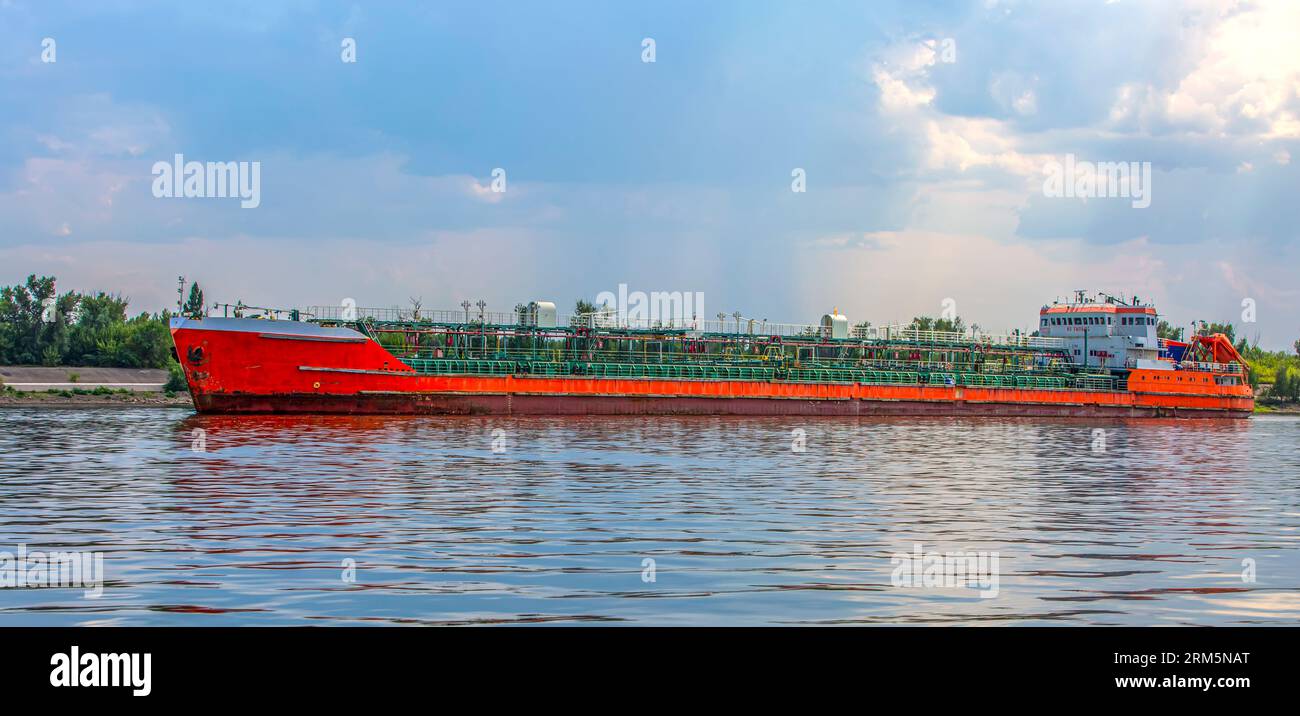 The Transport by industrial boat on the river. The red barge on the ...