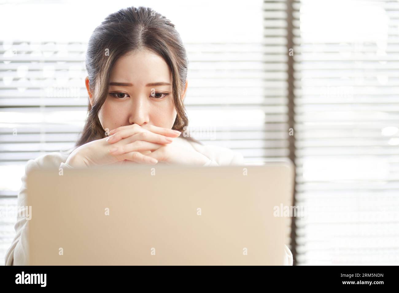 Asian woman thinking in trouble Stock Photo - Alamy