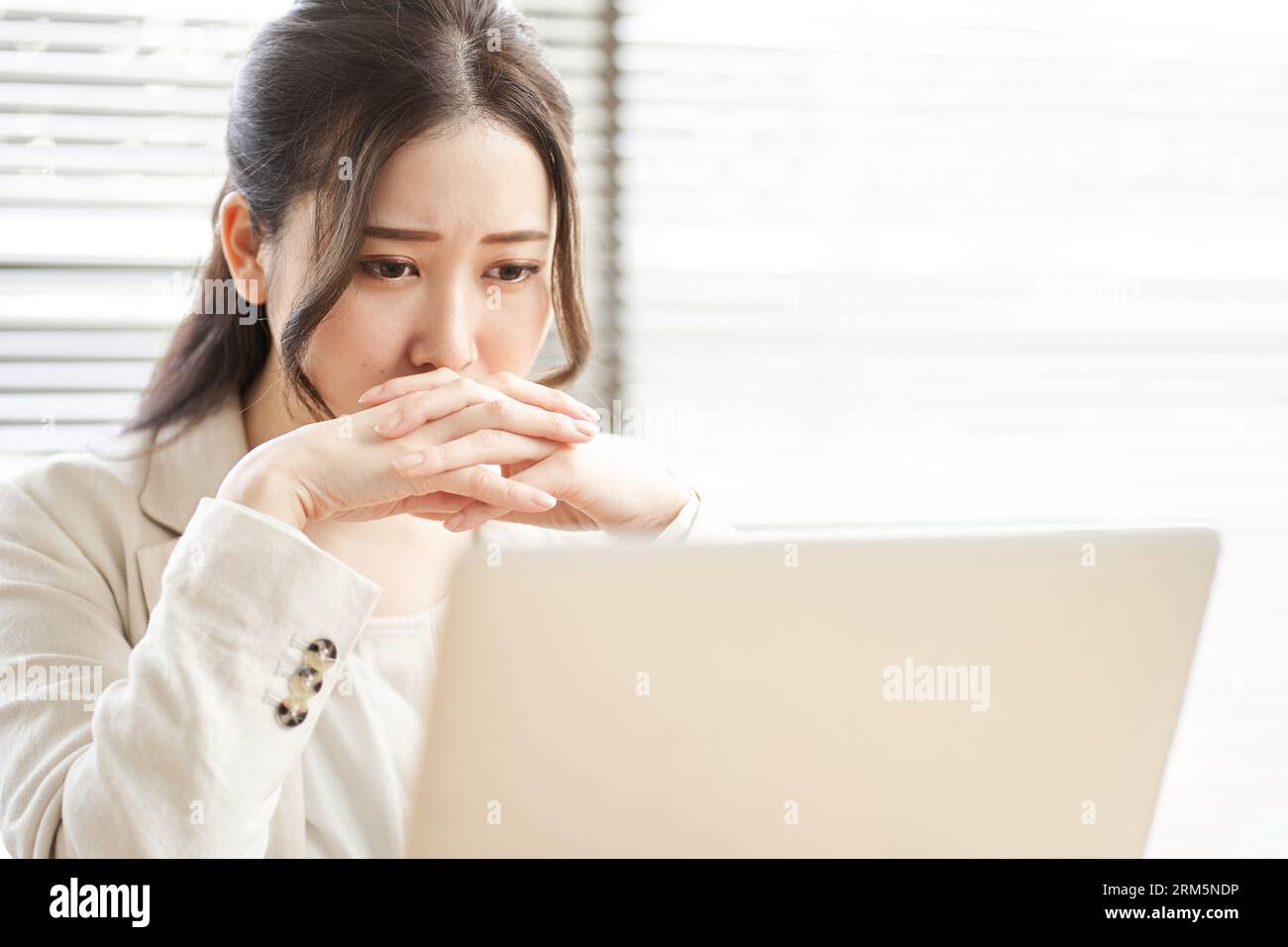 Asian woman thinking in trouble Stock Photo - Alamy