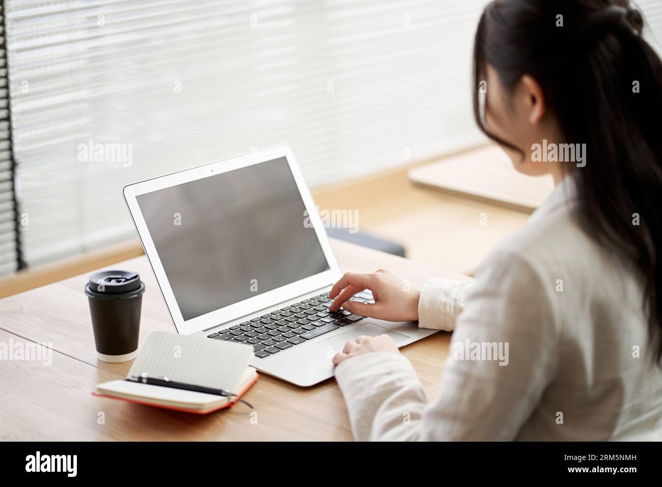 Asian woman computer back view cafe hi-res stock photography and images ...