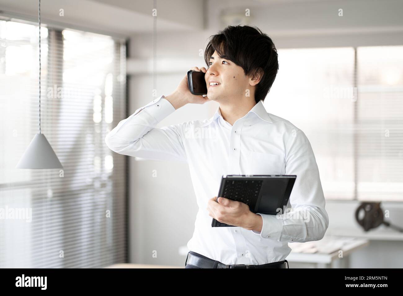 Asian man making business calls hi-res stock photography and images - Alamy
