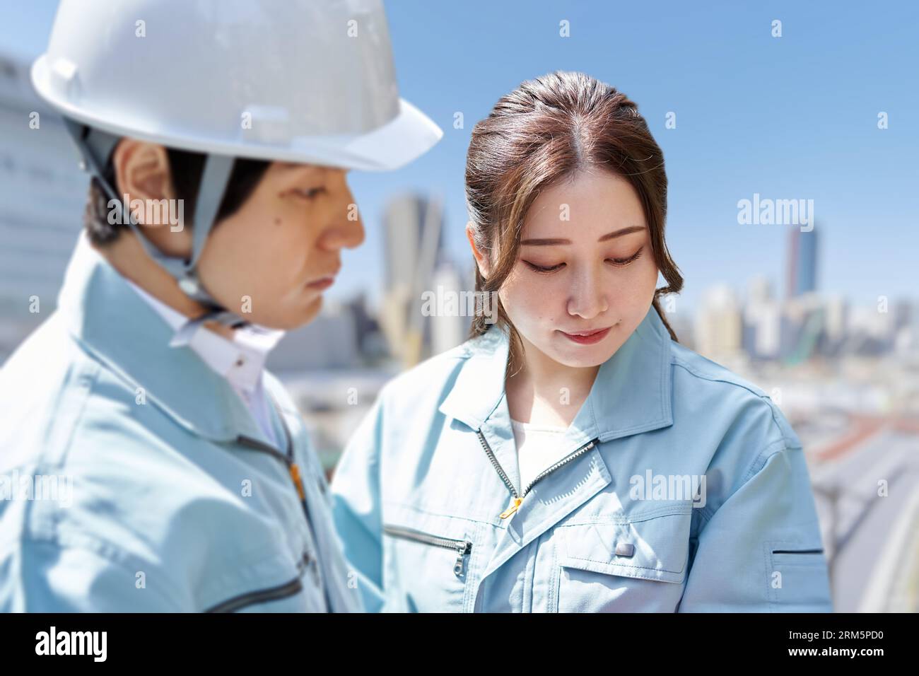 Asian workers having a meeting at the construction site Stock Photo - Alamy