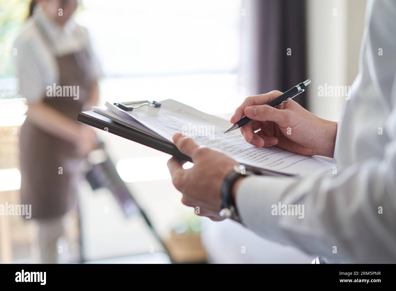 Asian men doing housework training Stock Photo - Alamy