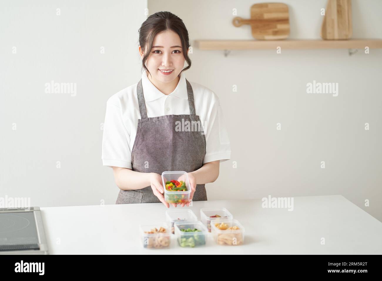 Asian woman cooking in the kitchen Stock Photo - Alamy