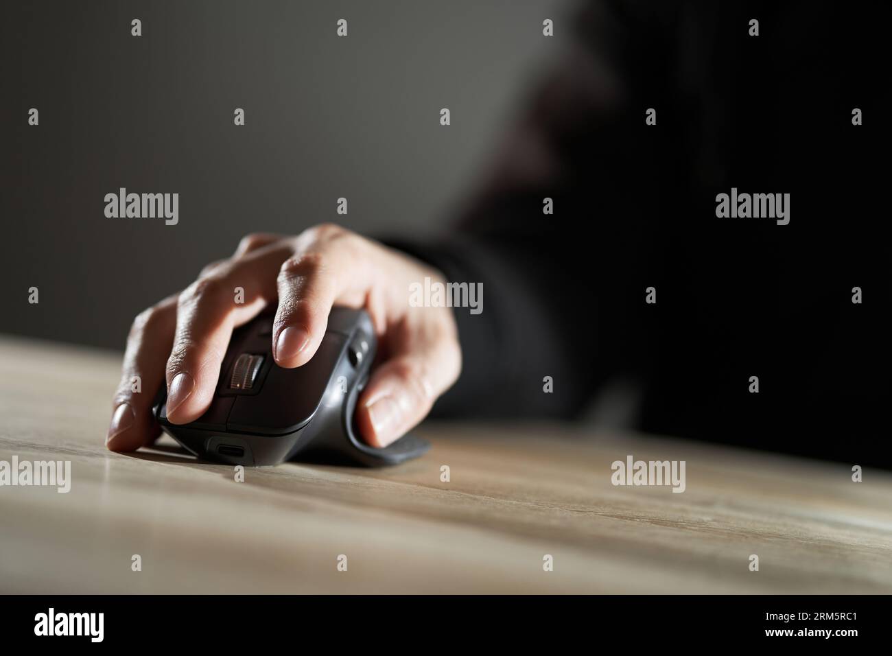 Hands of an Asian man operating a mouse Stock Photo - Alamy