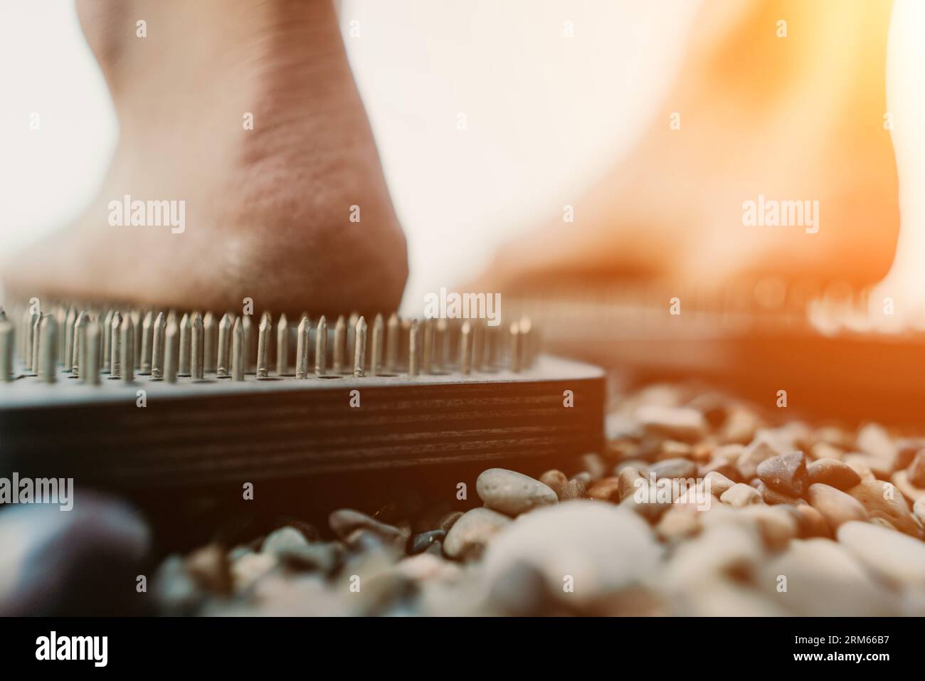 Sea Woman feet stepping on sadhu board during indian practice on the ...