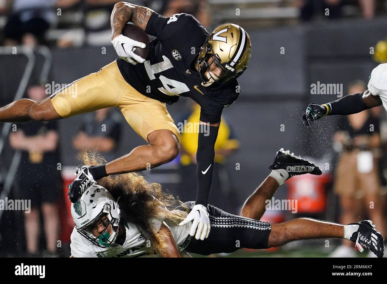 Vanderbilt wide receiver Will Sheppard (14) is stopped by Hawaii ...