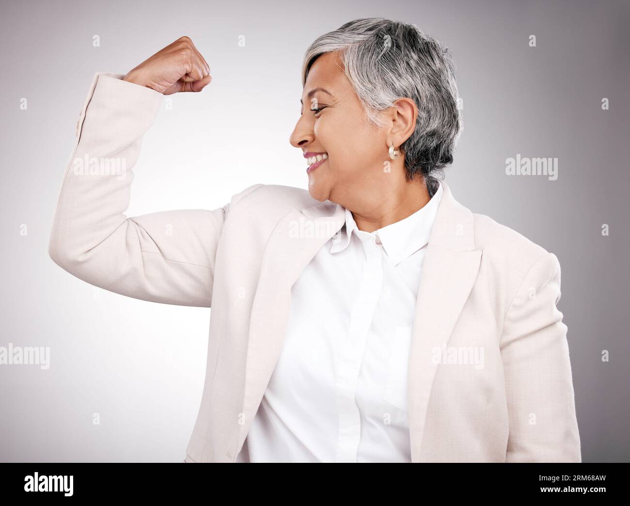 Strong, smile and mature businesswoman in a studio with strength ...