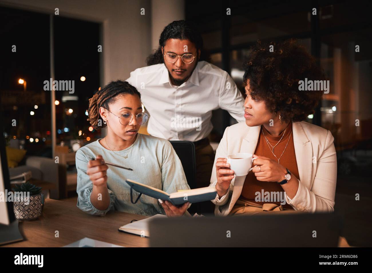 Meeting, late night and team in office with ideas, notes and planning ...