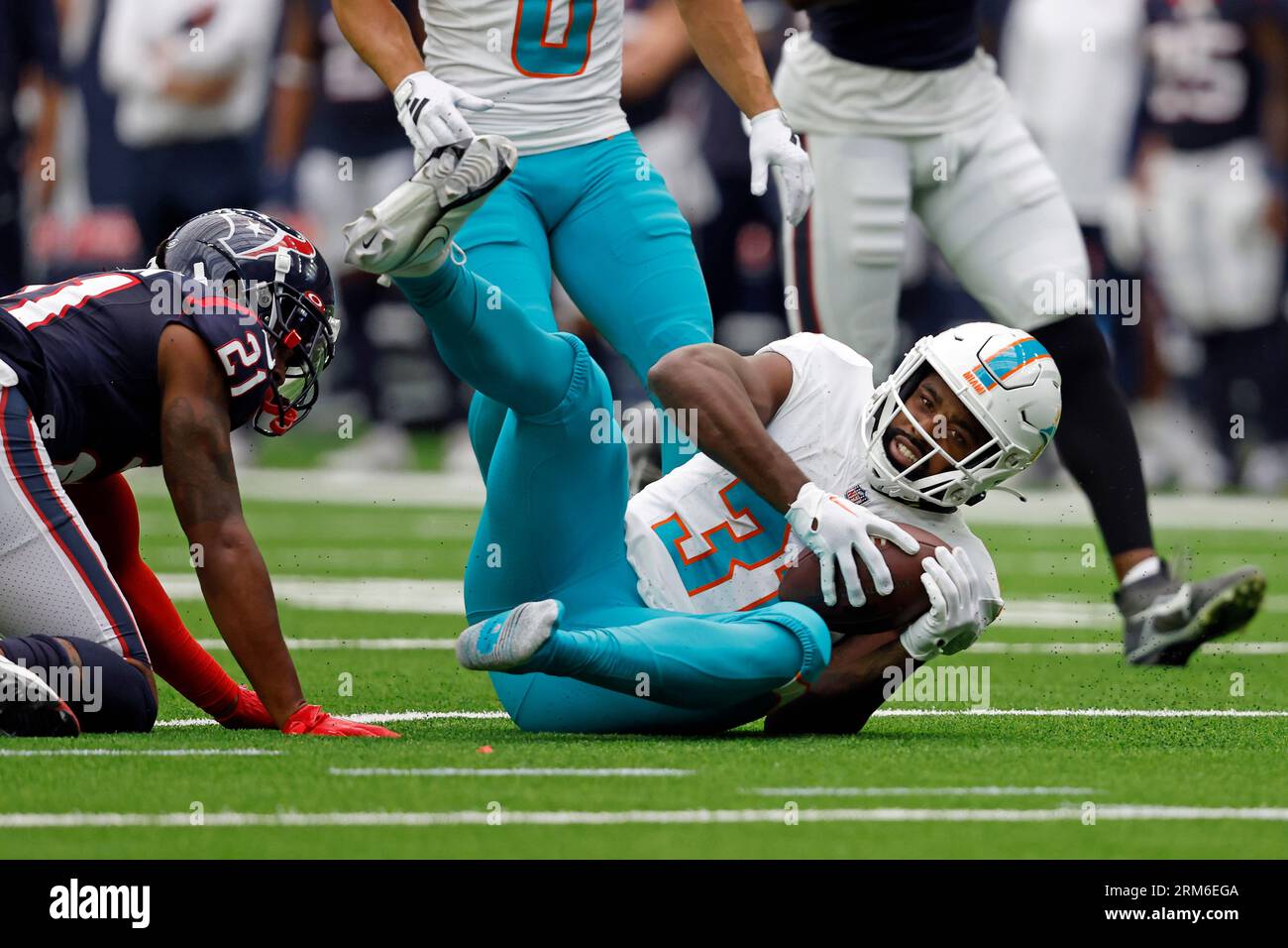 Miami Dolphins running back Raheem Mostert (31) after losing their shoe by being tripped up by ...