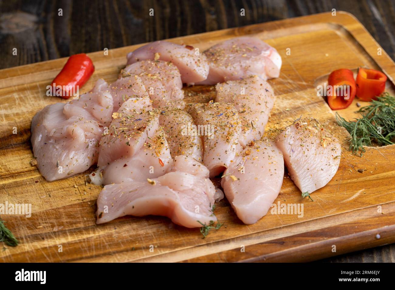 Freshly washed and skinned chicken meat, chicken fillets with salt and ...