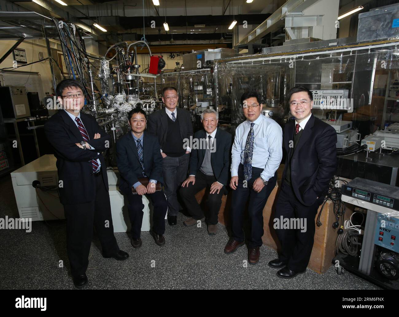 BEIJING - The photo taken on Dec. 31, 2013 shows project leader Zhao Zhongxian (3rd R) posing ...