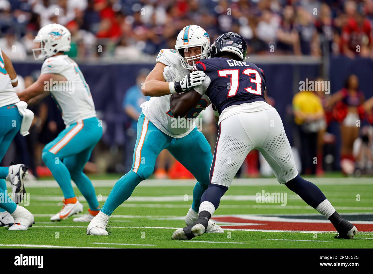 Miami Dolphins offensive tackle Ryan Hayes (76) and Houston Texans ...