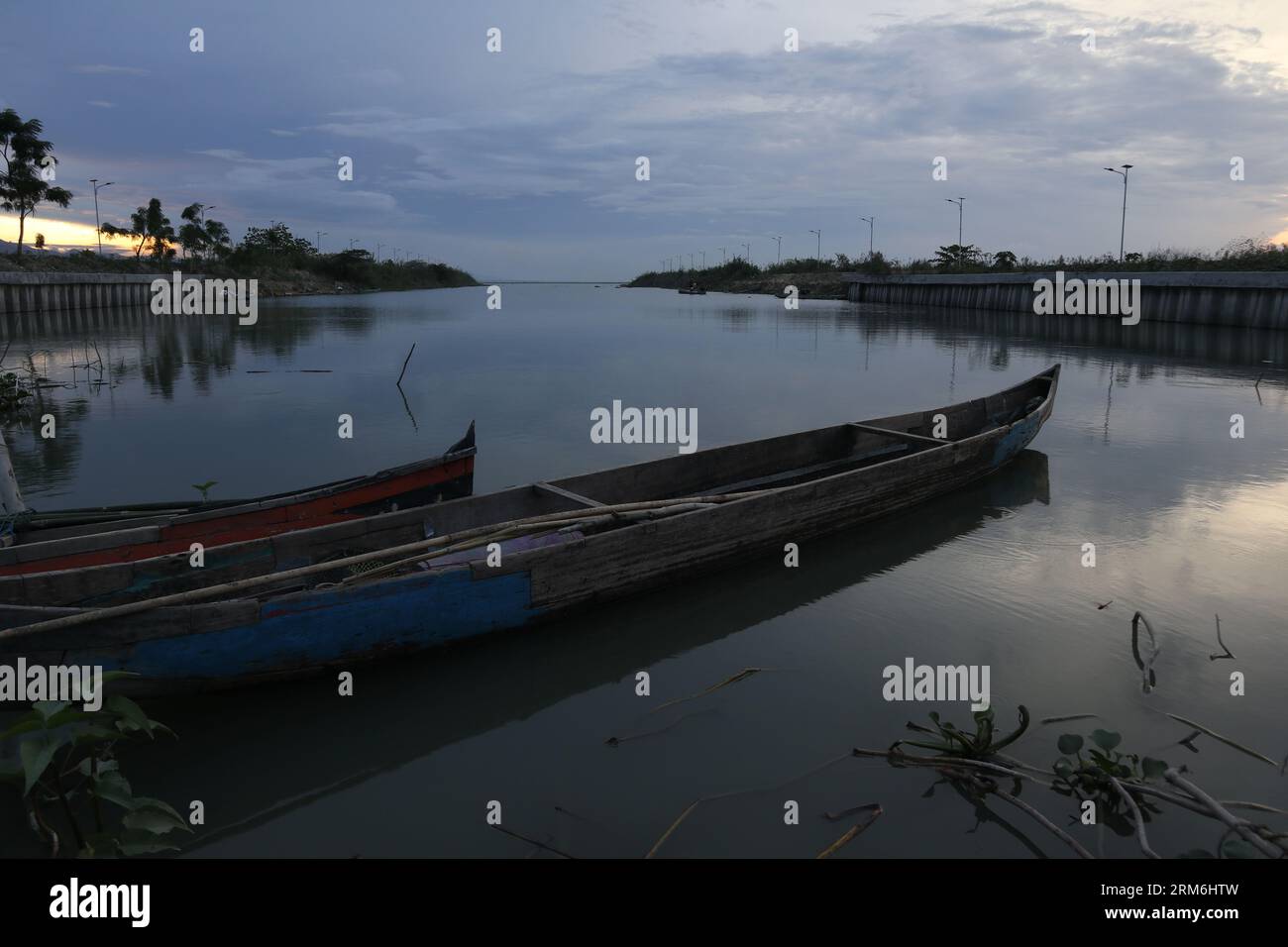 Traditional wooden boat floating on the waters of Lake Limboto ...