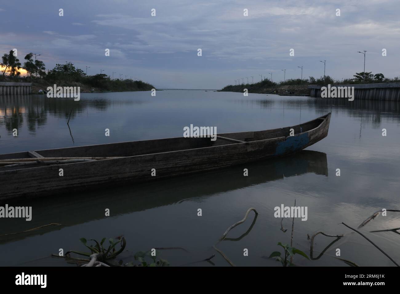 Traditional wooden boat floating on the waters of Lake Limboto ...