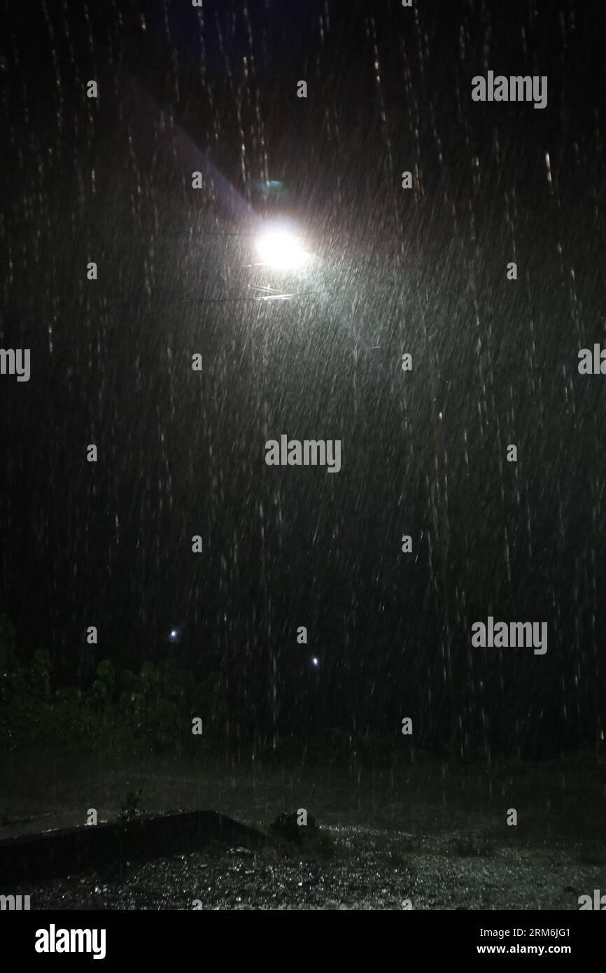 rain at night. Dark background shot of rain falling Stock Photo - Alamy