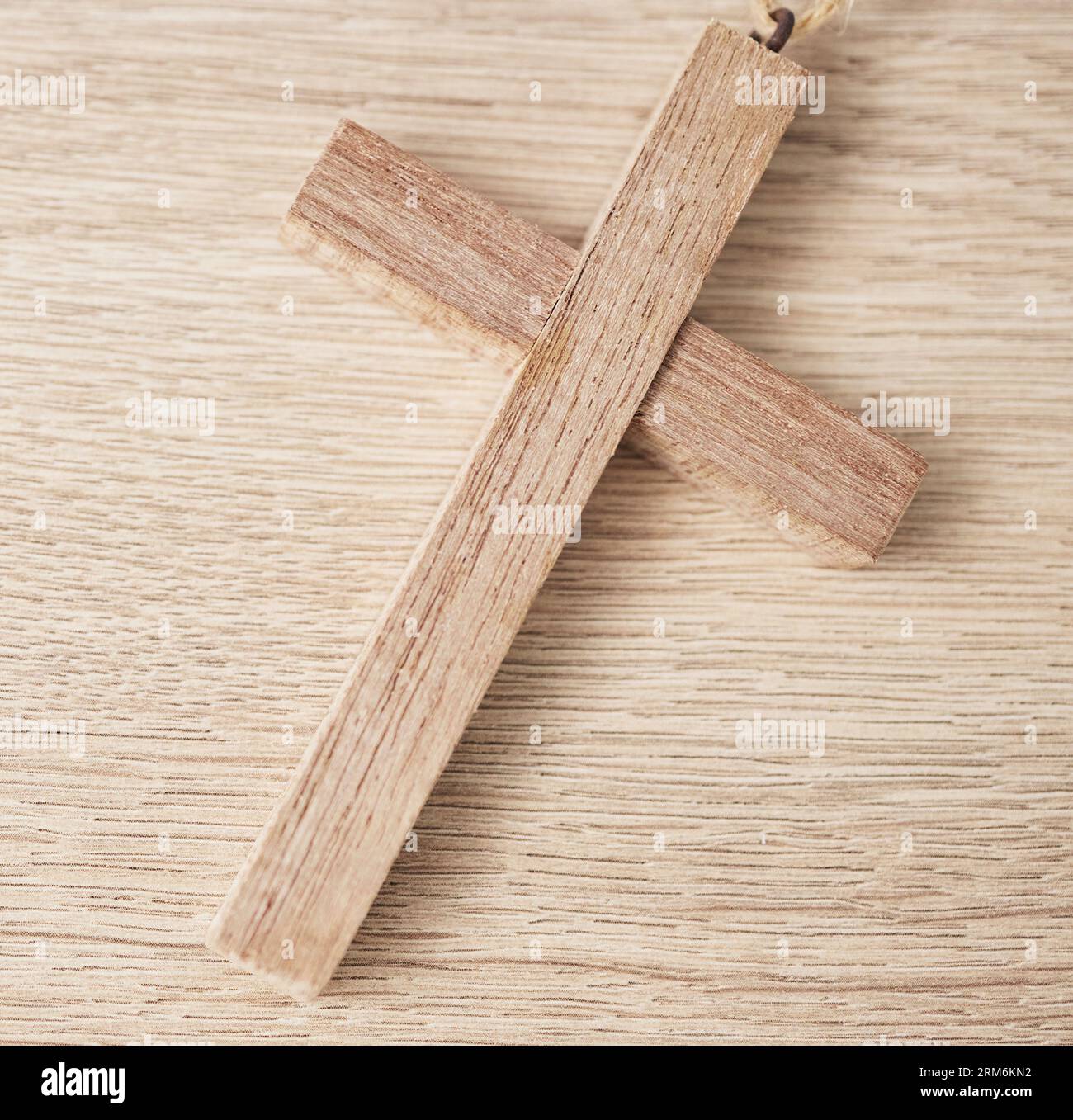 Background, religion and closeup of wooden cross on table for worship ...