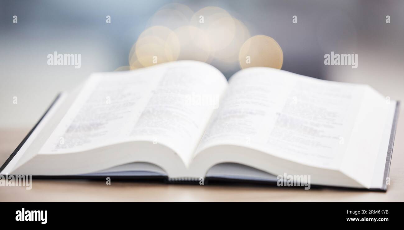 Religion, christian and bible book on a table for praying, spiritual ...