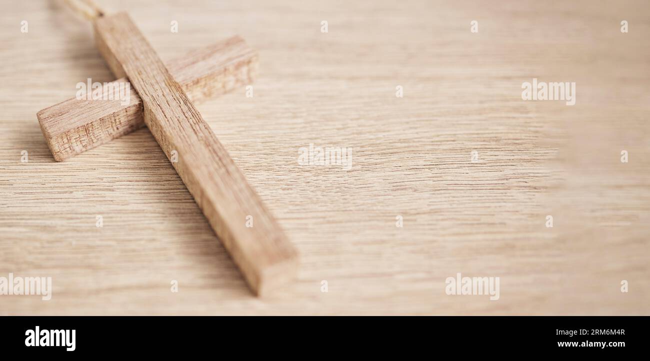Background, religion and space of wood cross on table for worship to ...