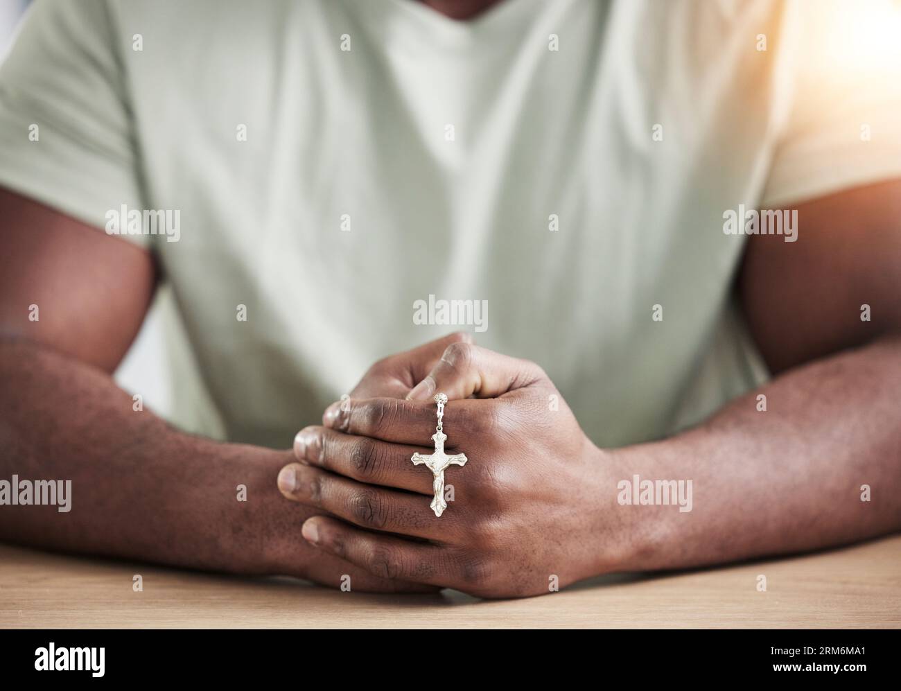 Crucifix cross, man hands and prayer beads in home with faith ...