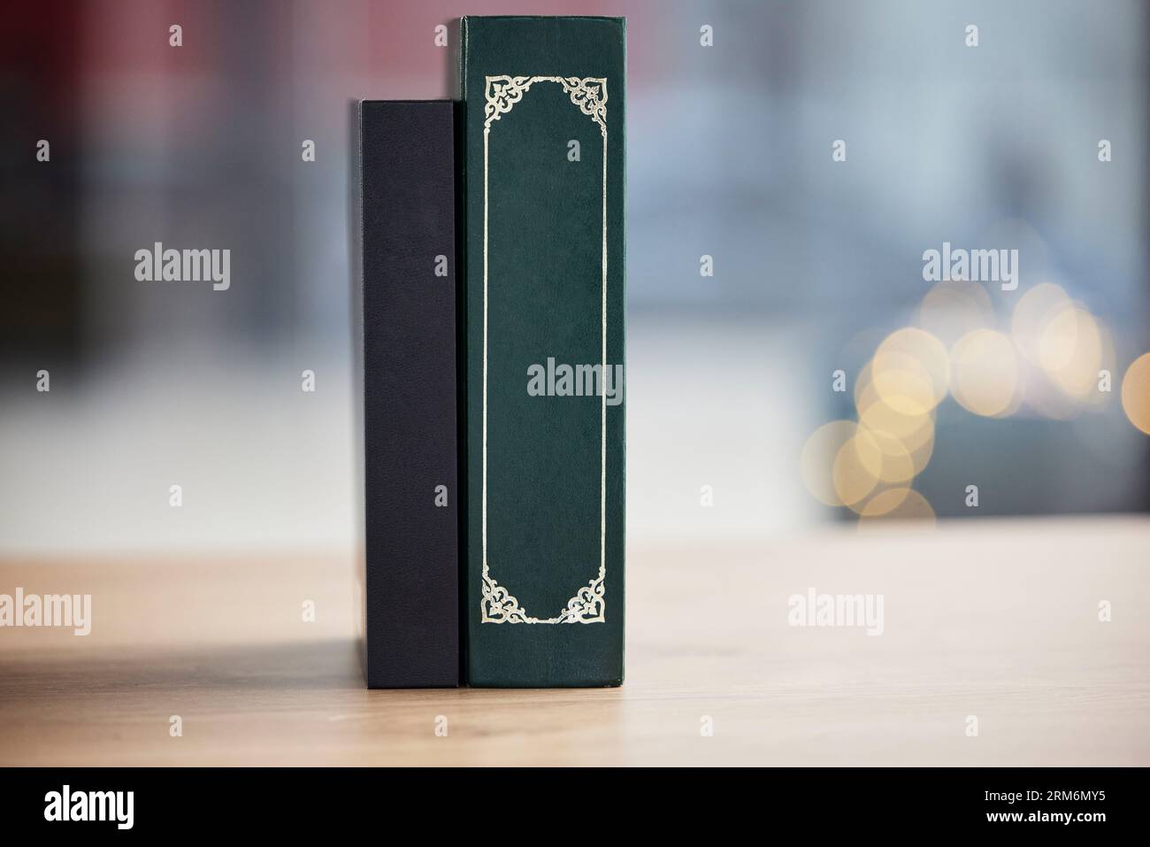 Books on table, mockup space and bokeh for religion, reading and study ...