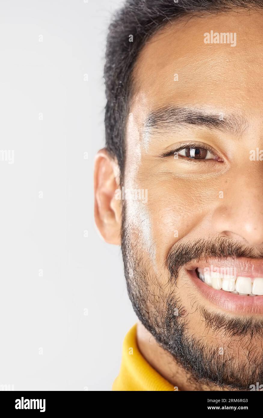Half face, smile of man and skincare in studio isolated on a white ...
