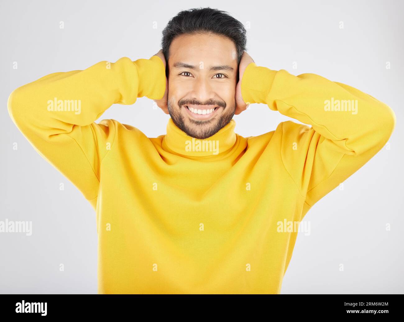 Portrait, smile and man cover ears in studio isolated on a white ...