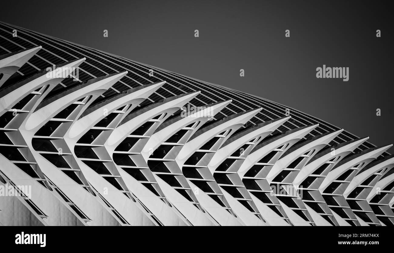 A grayscale of a building with modern architectural design Stock Photo ...